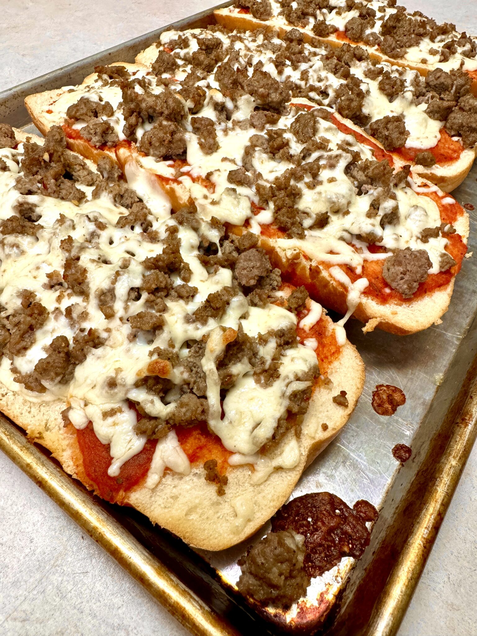 Garlic Butter French Bread Pizzas - The Lazy K Kitchen